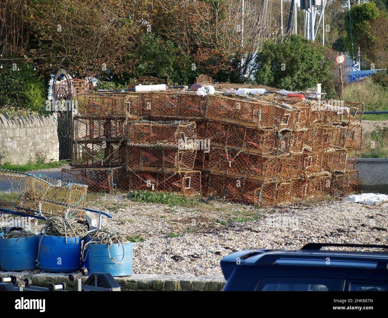 Rectangular lobster pots stacked on the beach, Warsash, Hampshire ...