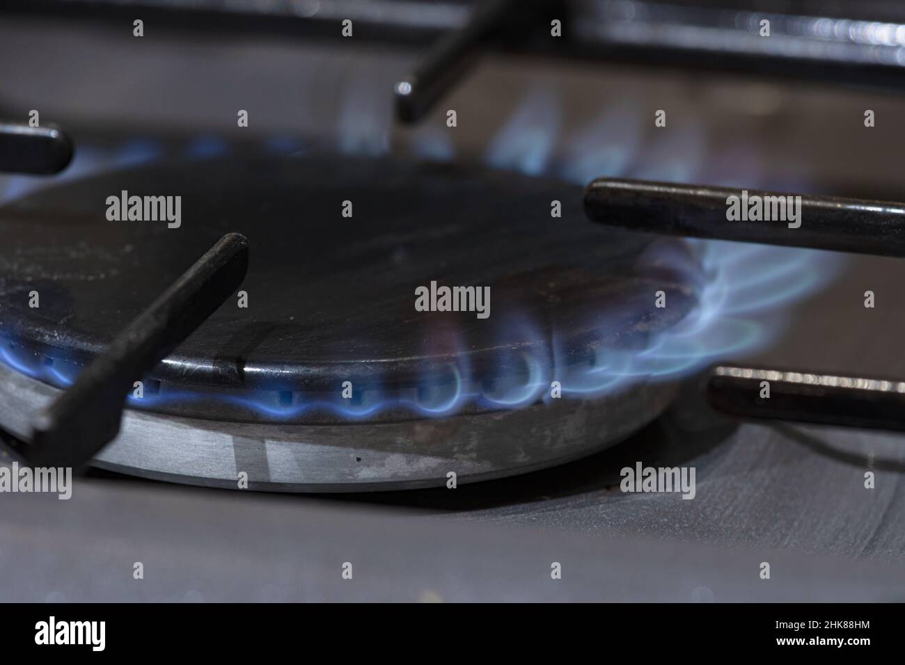 A gas ring on a cooker with increasing flames rising to the right Stock ...