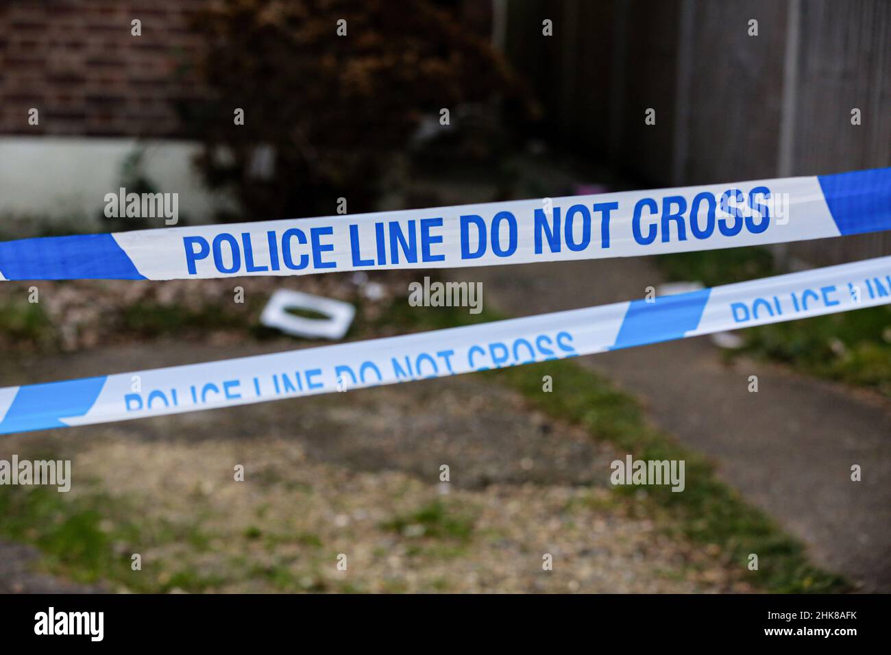 A police tape is attached surrounding a crime scene in London Stock ...