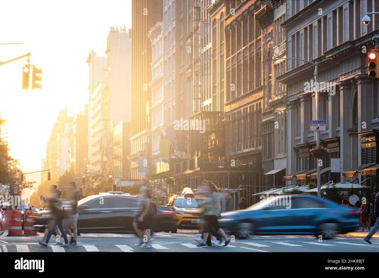 Busy intersection with people and traffic on 5th Avenue in New York ...
