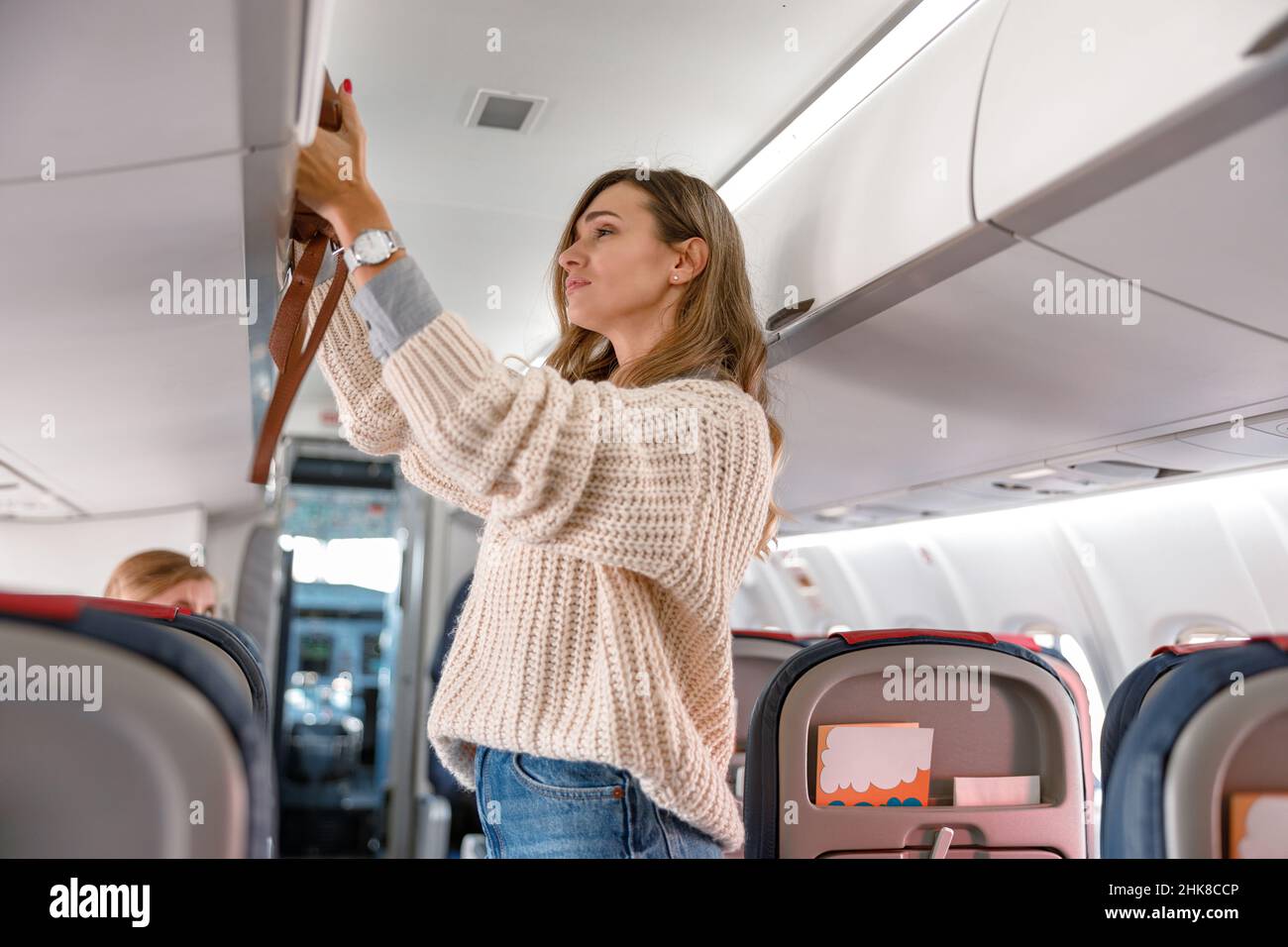 Airplane overhead compartment hi-res stock photography and images - Alamy
