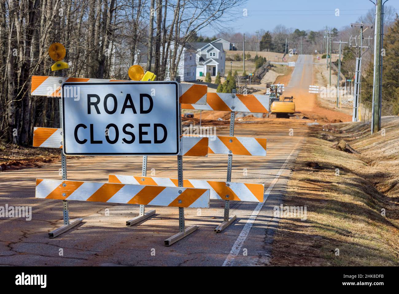 Road reconstruction with caution sign road closed in local access ...