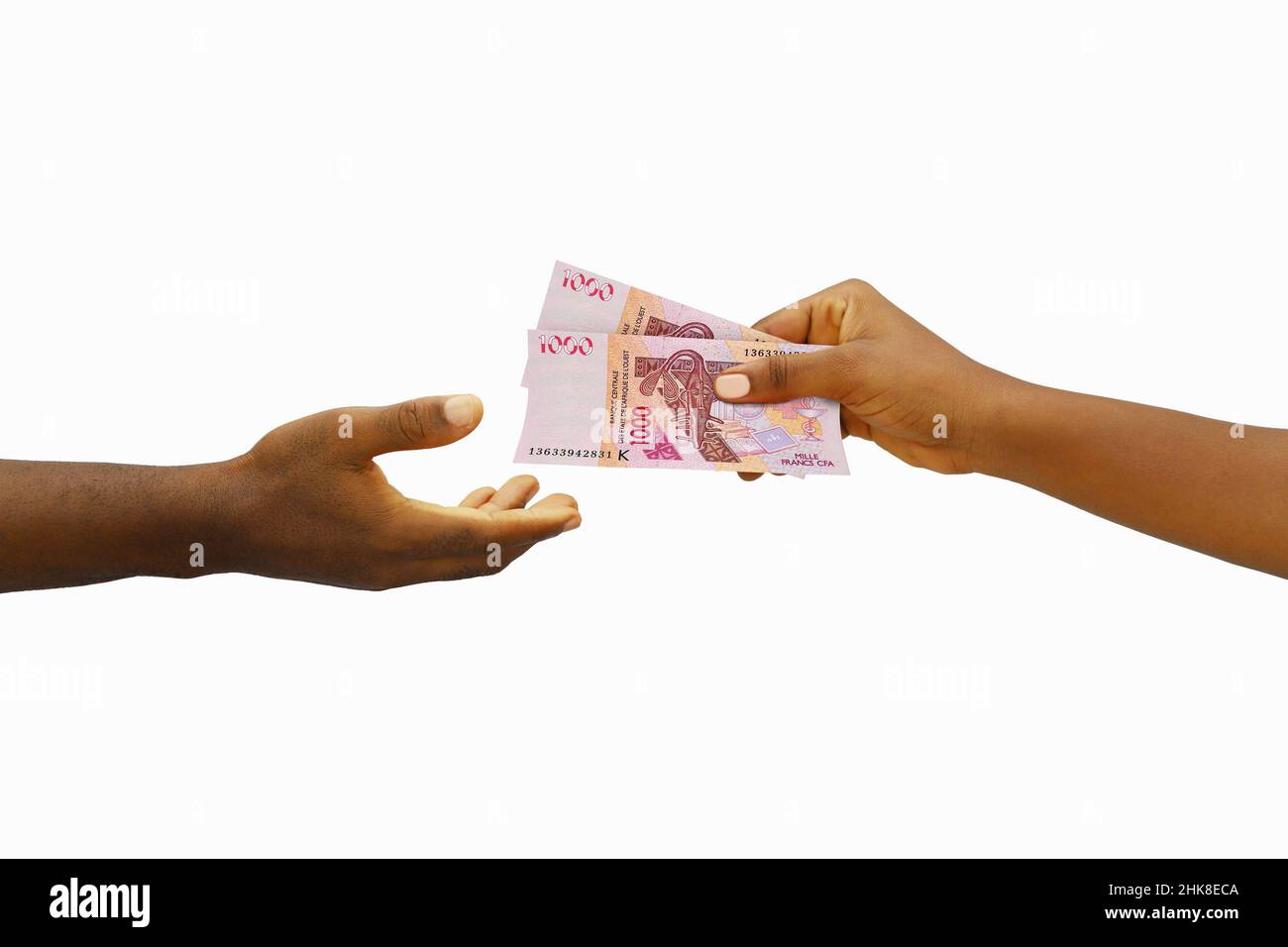 Hand giving 3D rendered CFA Franc notes to another hand. Hand receiving ...