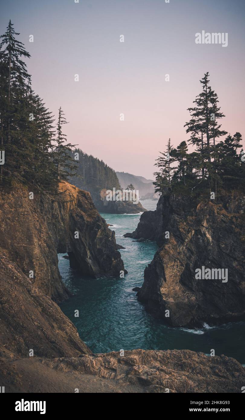 Sunset on natural bridges along the west coast of the Pacific Ocean ...