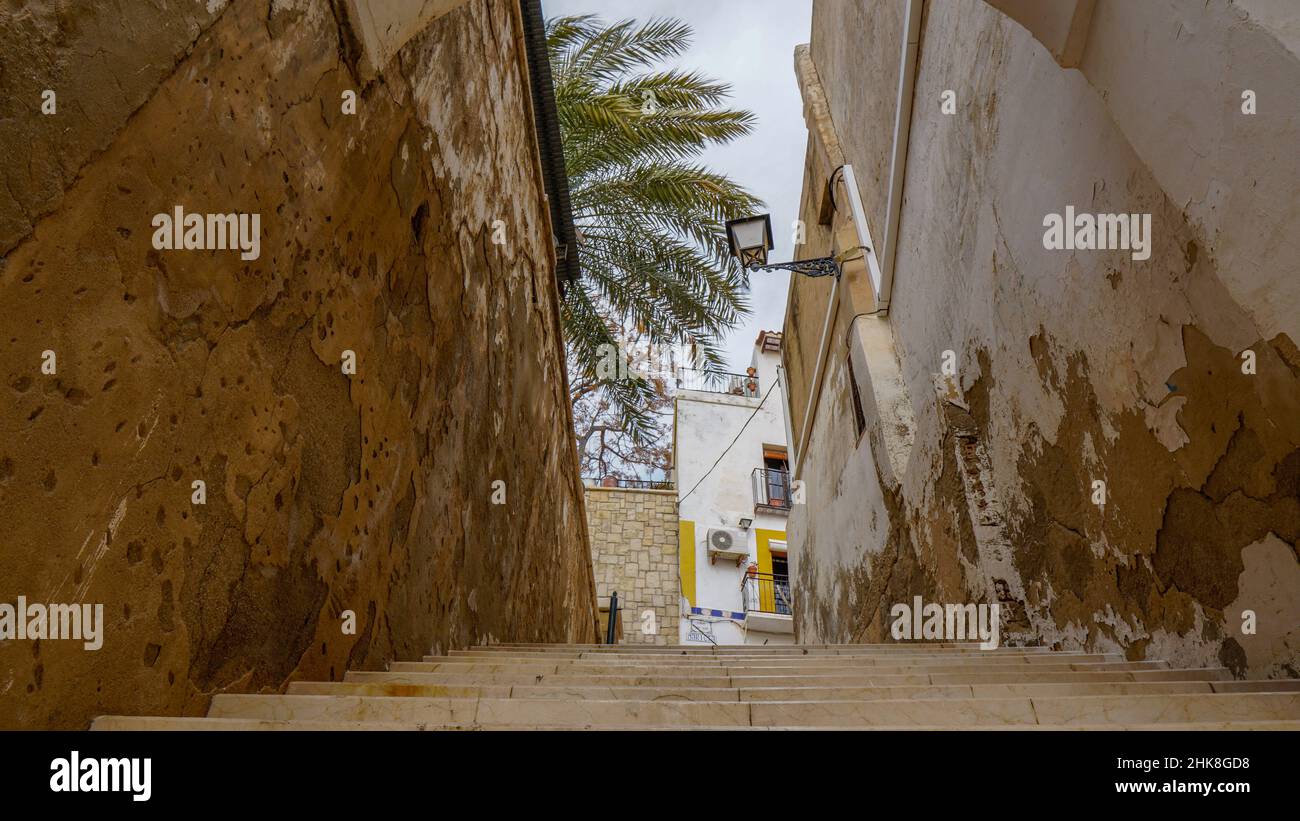 Low angle shot of stairs between two old buildings Stock Photo - Alamy