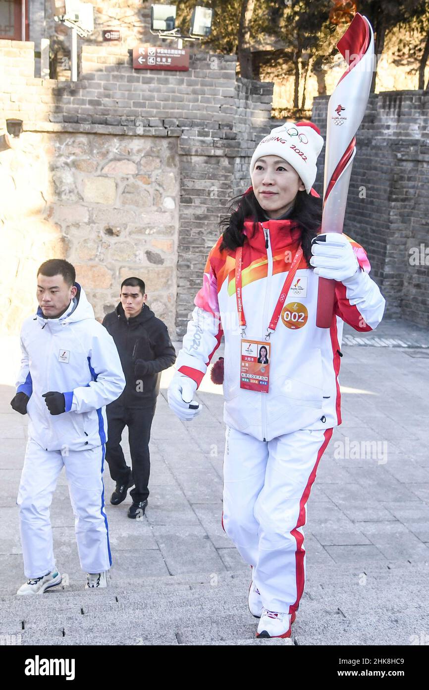Beijing, China. 3rd Feb, 2022. Torch bearer Pang Qing (front) runs with the torch during the ...