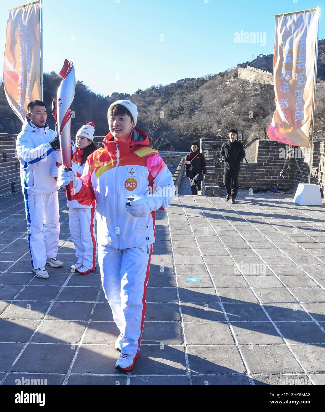 Beijing, China. 3rd Feb, 2022. Torch bearer Chen Yufei runs with the torch during the Beijing ...