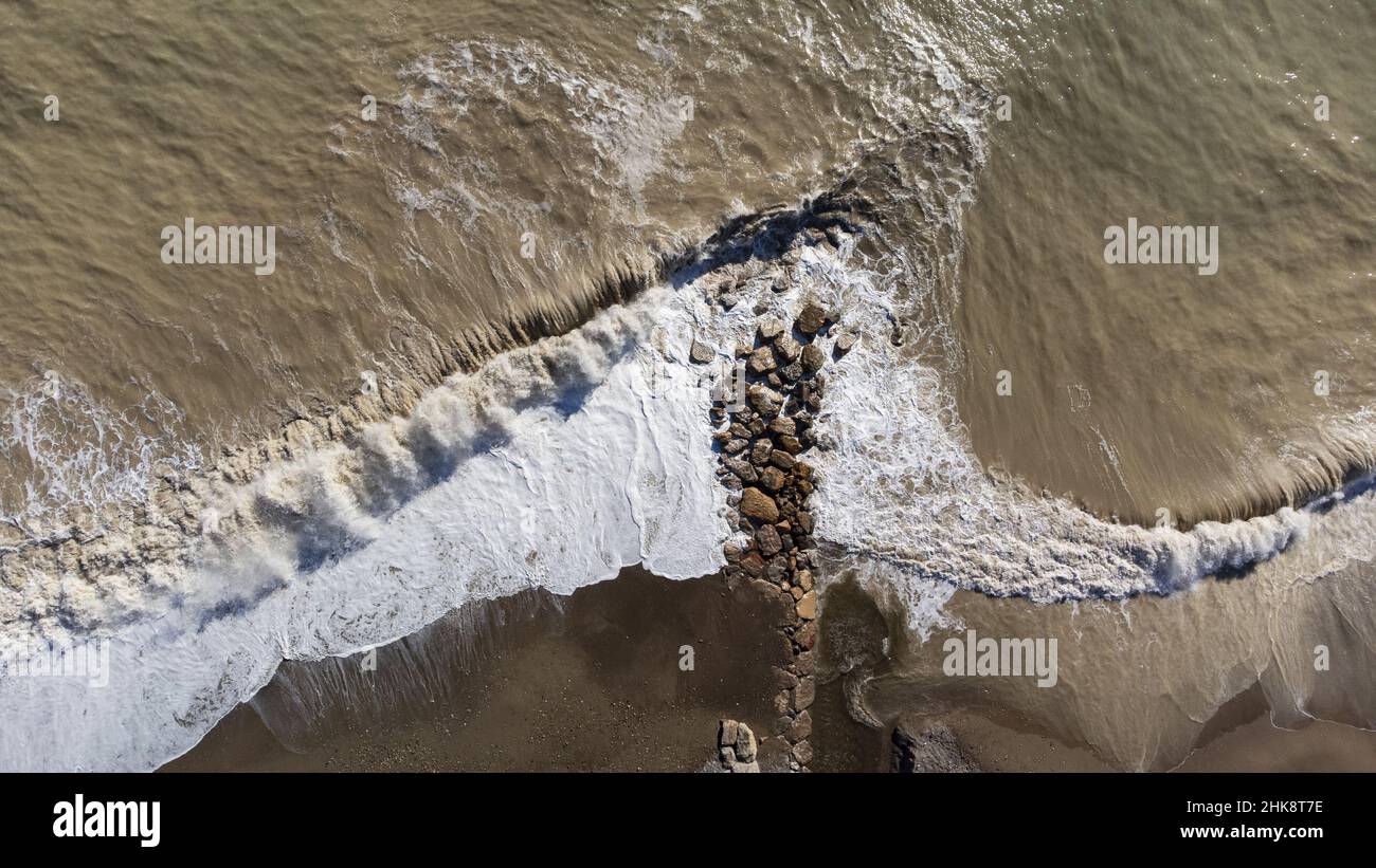 top view of a Breakwater being hit by waves Stock Photo - Alamy