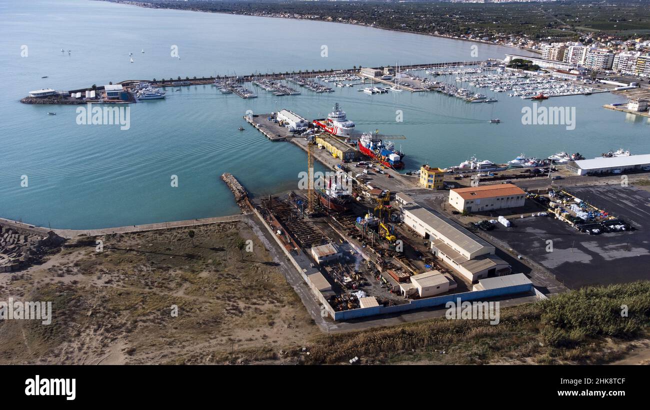 Top view of an empty maintenance shipyard next to the Mediterranean Sea ...