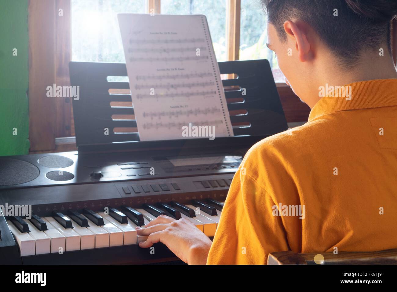 Closeup of a boy trying to play the piano - frustration concept Stock ...