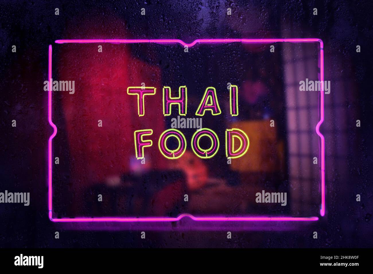 Neon Sign Thai Food in Rainy Window Stock Photo - Alamy