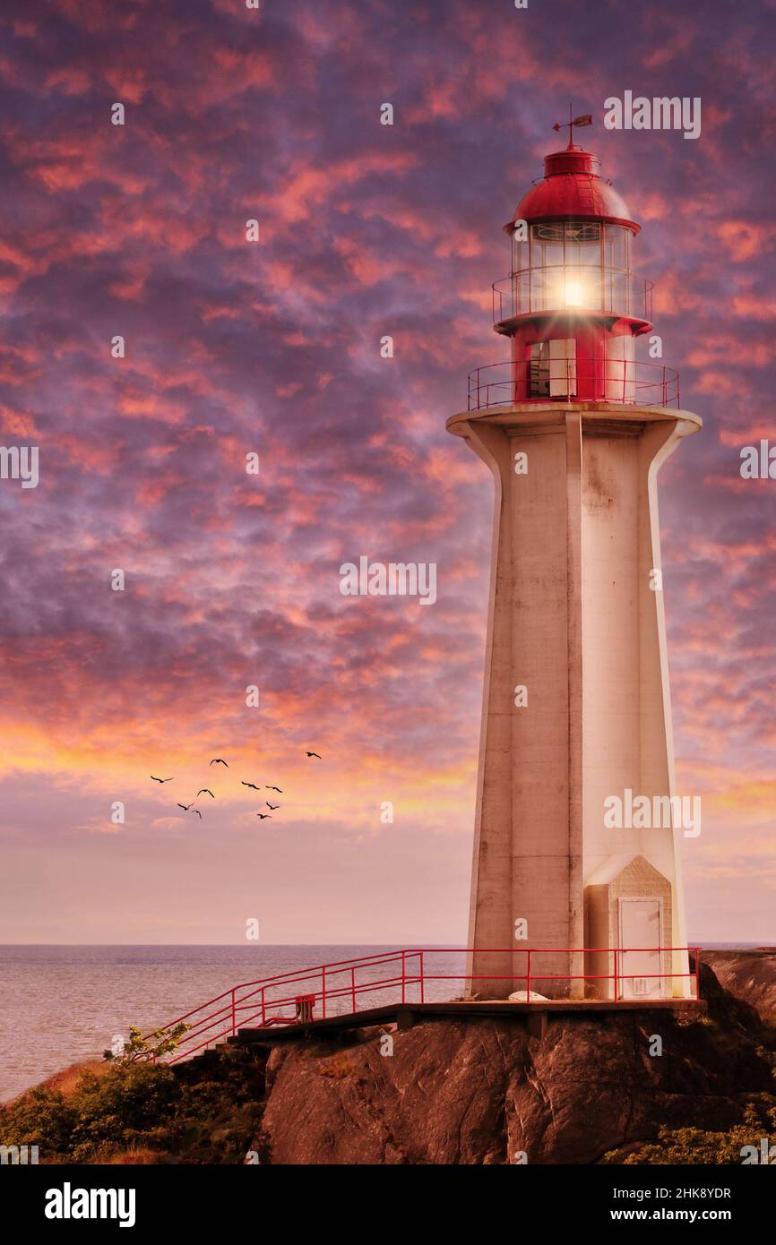 Beaming Point Atkinson lighthouse overlooking ocean under a dramatic ...