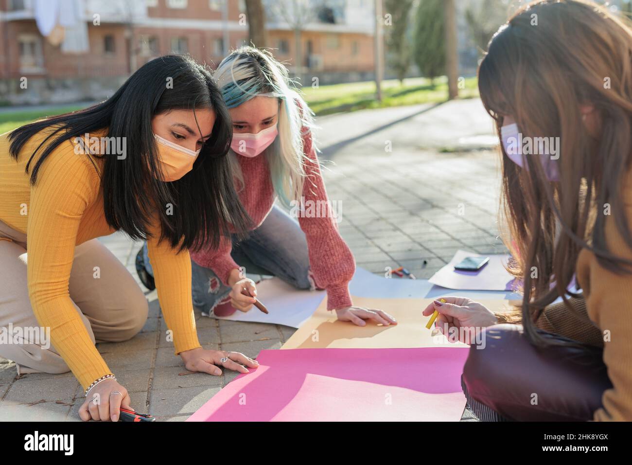 Multicultural group preparing together feminist movement womens ...