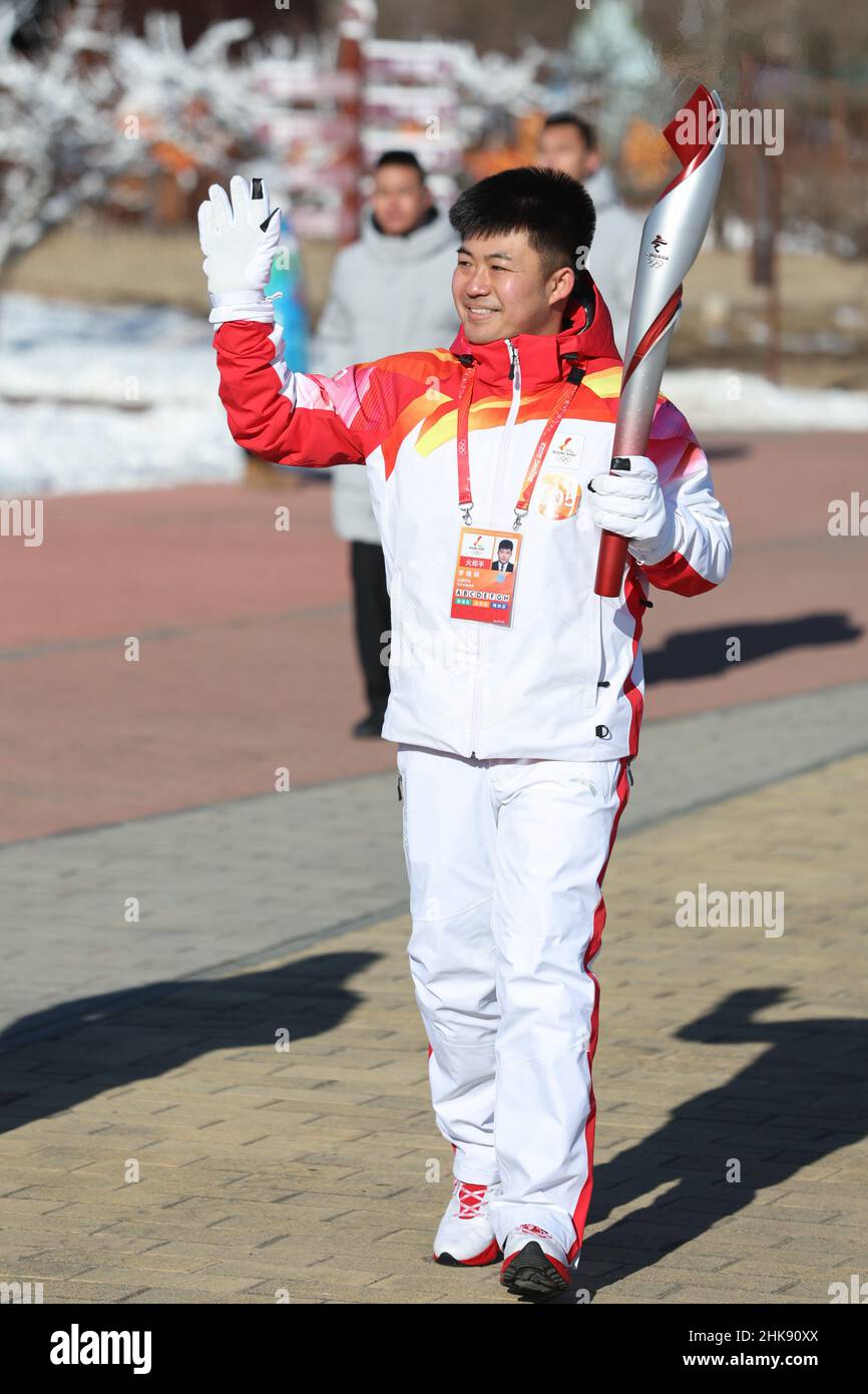 Beijing, China. 3rd Feb, 2022. Torch bearer Li Xiaoyan runs with the torch during the Beijing ...