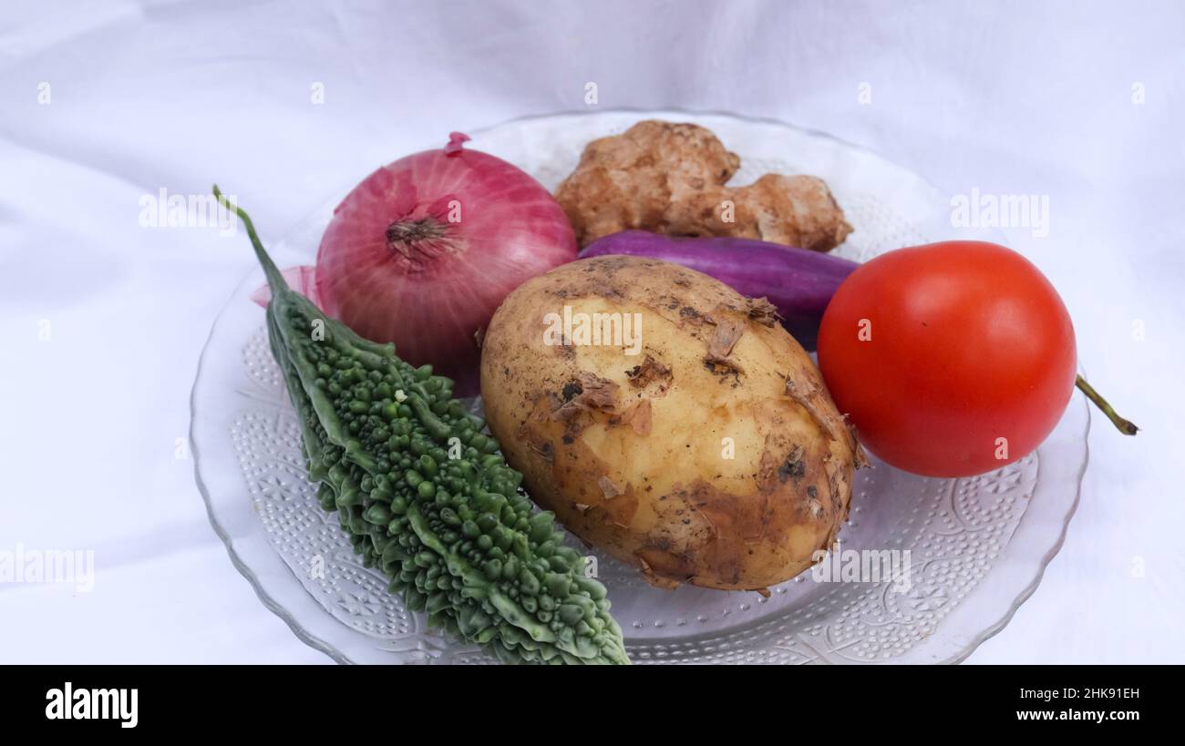 vegetables in the plate. with dim white background Stock Photo - Alamy