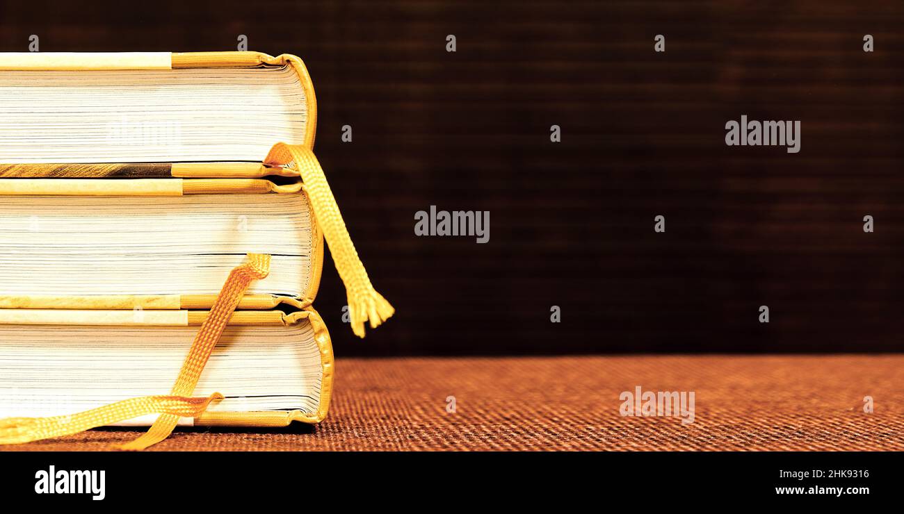 Banner template with hardcovered books stack with bookmarks on a shelf ...