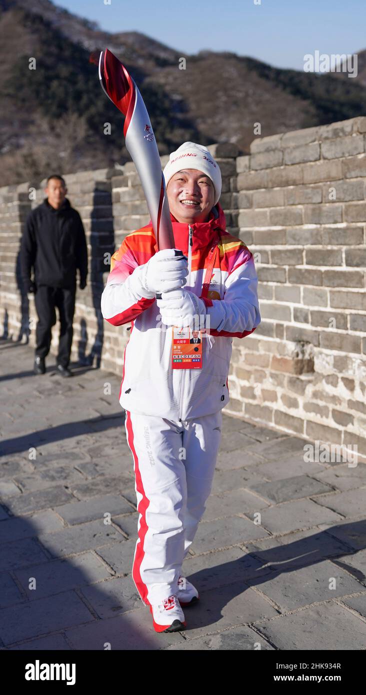 Beijing, China. 3rd Feb, 2022. Torch bearer Kang Zhi runs with the torch during the Beijing 2022 ...