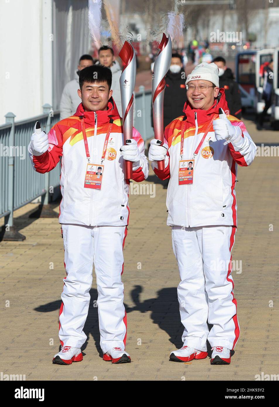 Beijing, China. 3rd Feb, 2022. Torch bearers Li Xiaoyan (L) and Cao ...