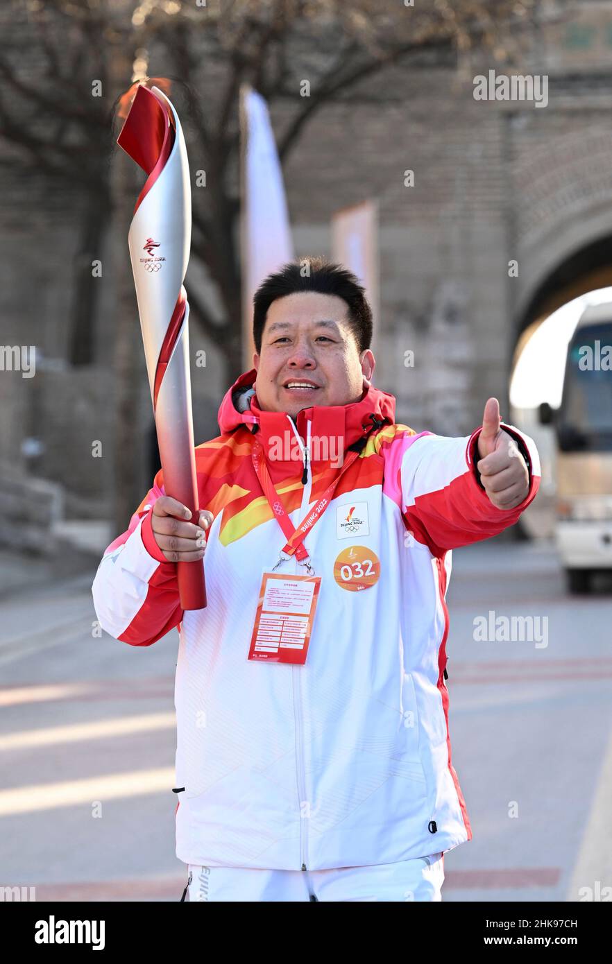 Beijing, China. 3rd Feb, 2022. Torch bearer Zhao Wei runs with the torch during the Beijing 2022 ...