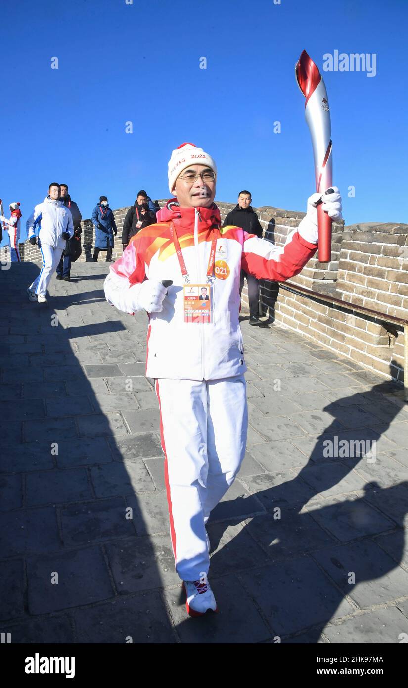 Beijing, China. 3rd Feb, 2022. Torch bearer Shen Hongbo runs with the torch during the Beijing ...