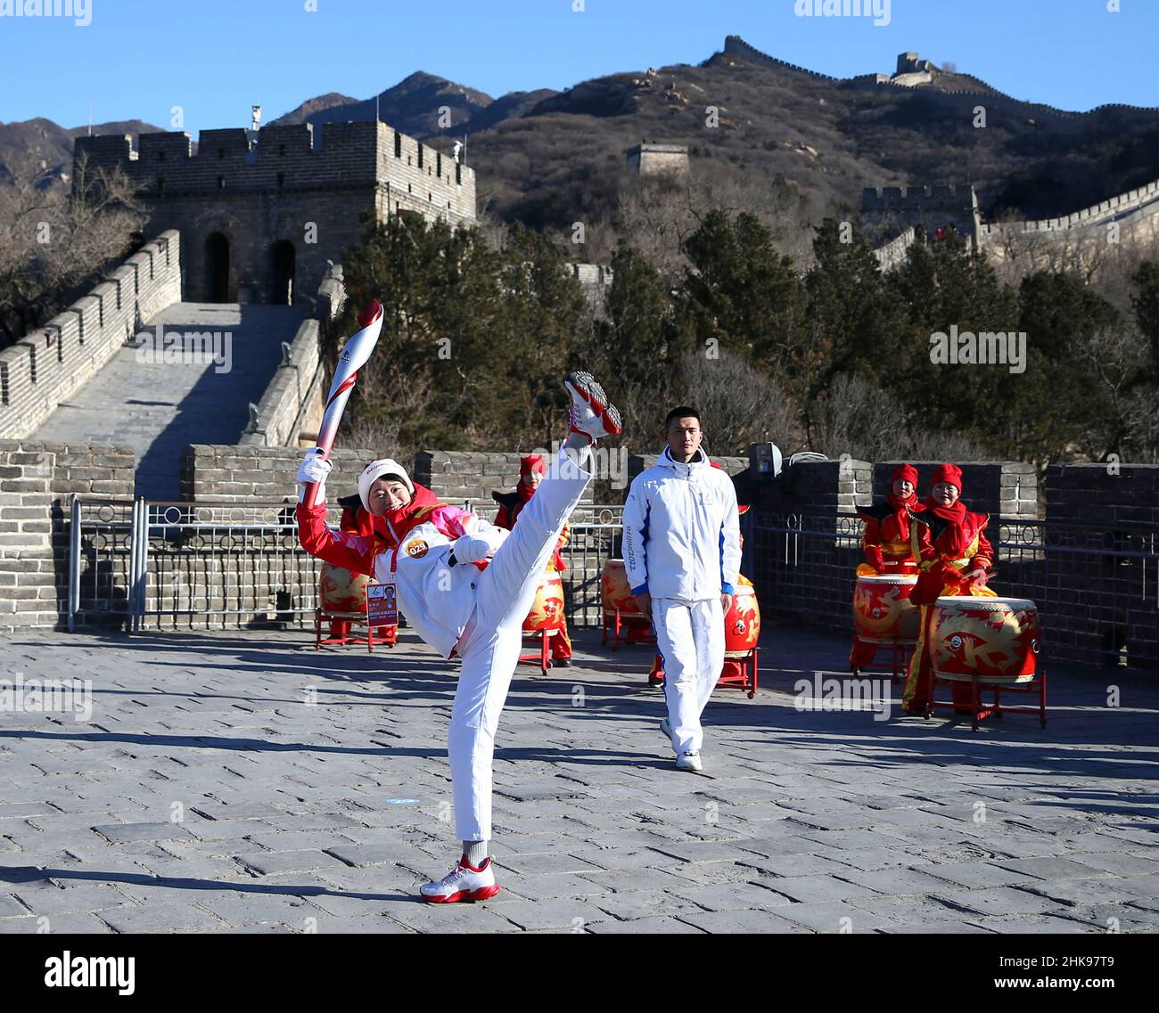 Beijing, China. 3rd Feb, 2022. Torch bearer Wu Jingyu reacts with the torch during the Beijing ...