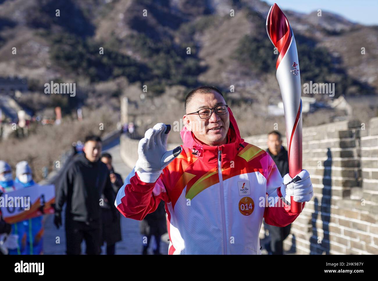 Beijing, China. 3rd Feb, 2022. Torch bearer Han Xiaoyan runs with the torch during the Beijing ...