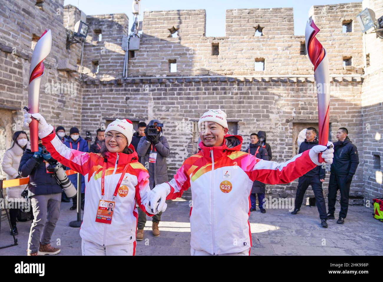 Beijing, China. 3rd Feb, 2022. Torch bearers He Qiang (R) and Li Ling ...