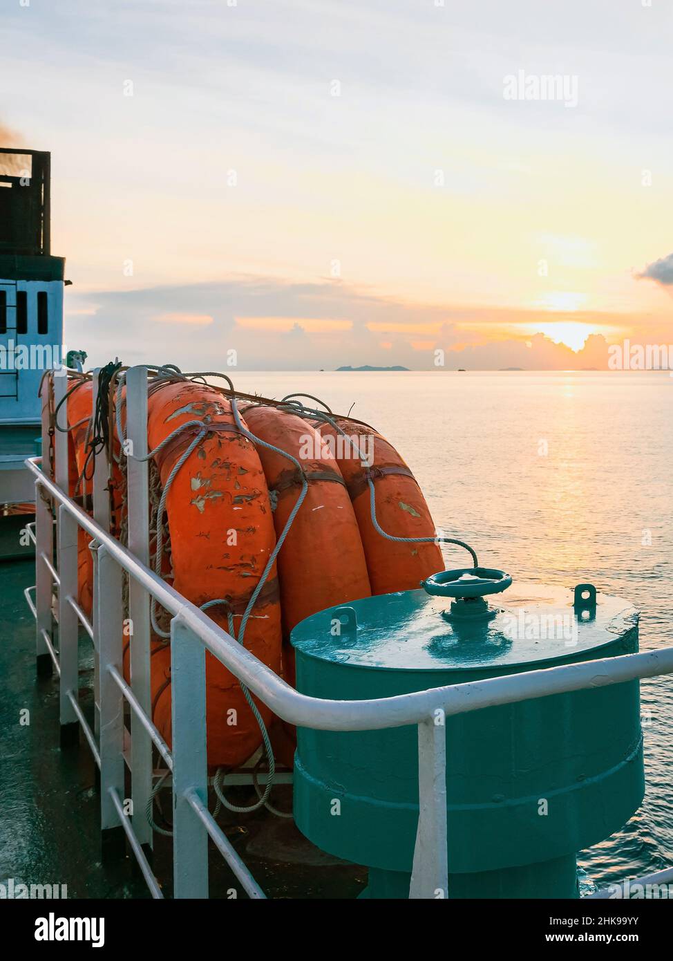 Orange inflatable lifeboats on ferry deck for emergencies and maritime ...