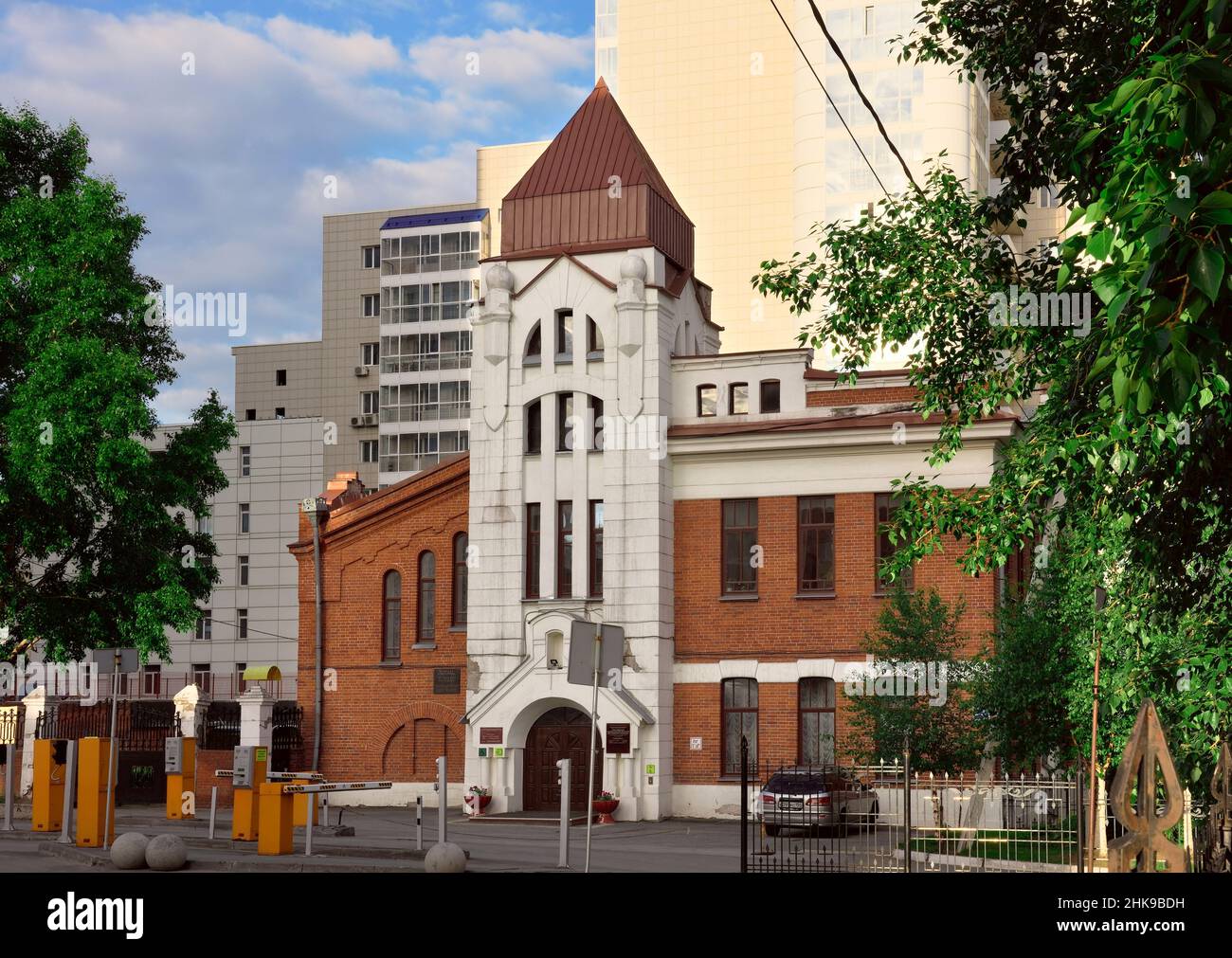 A historic red brick elementary school building with a white tower ...