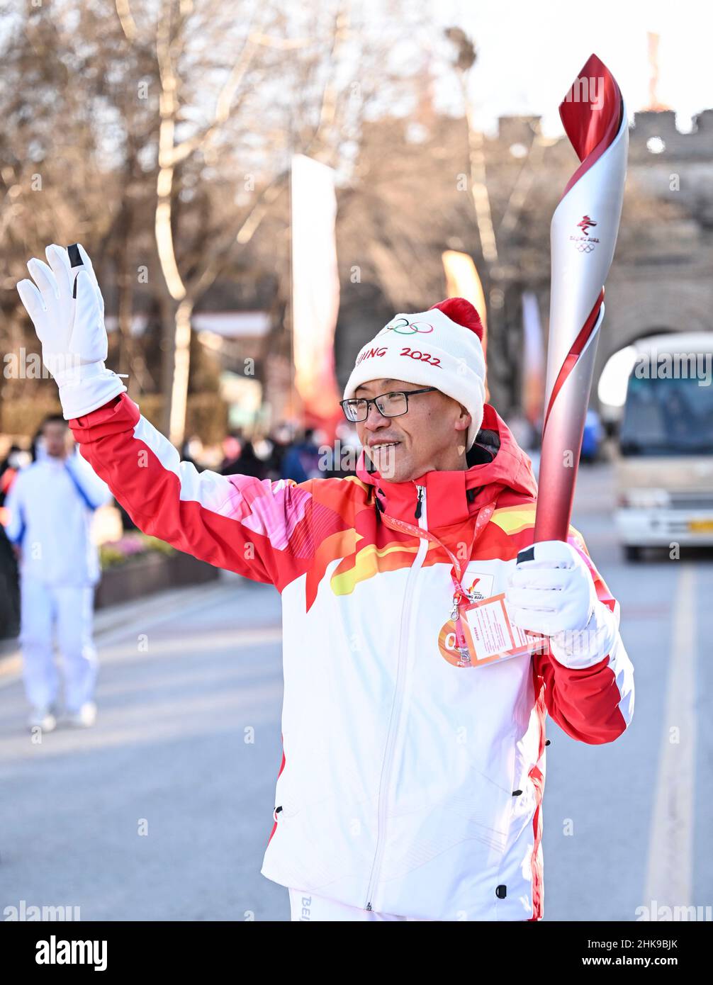 Beijing, China. 3rd Feb, 2022. Torch bearer Li Tao runs with the torch during the Beijing 2022 ...