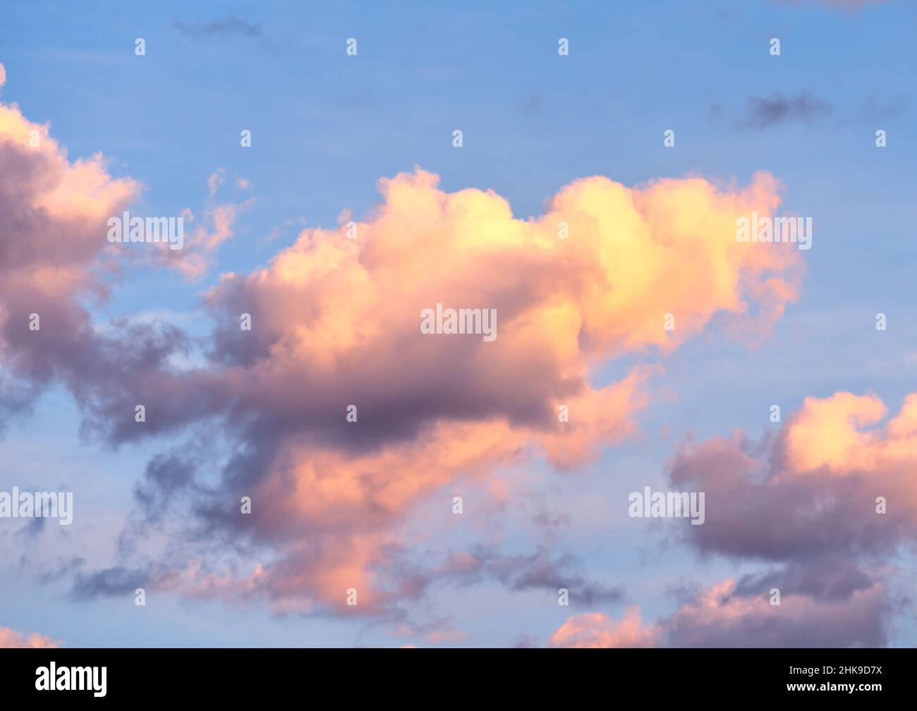 Golden orange fluffy clouds on a blue sky. Background image, without ...