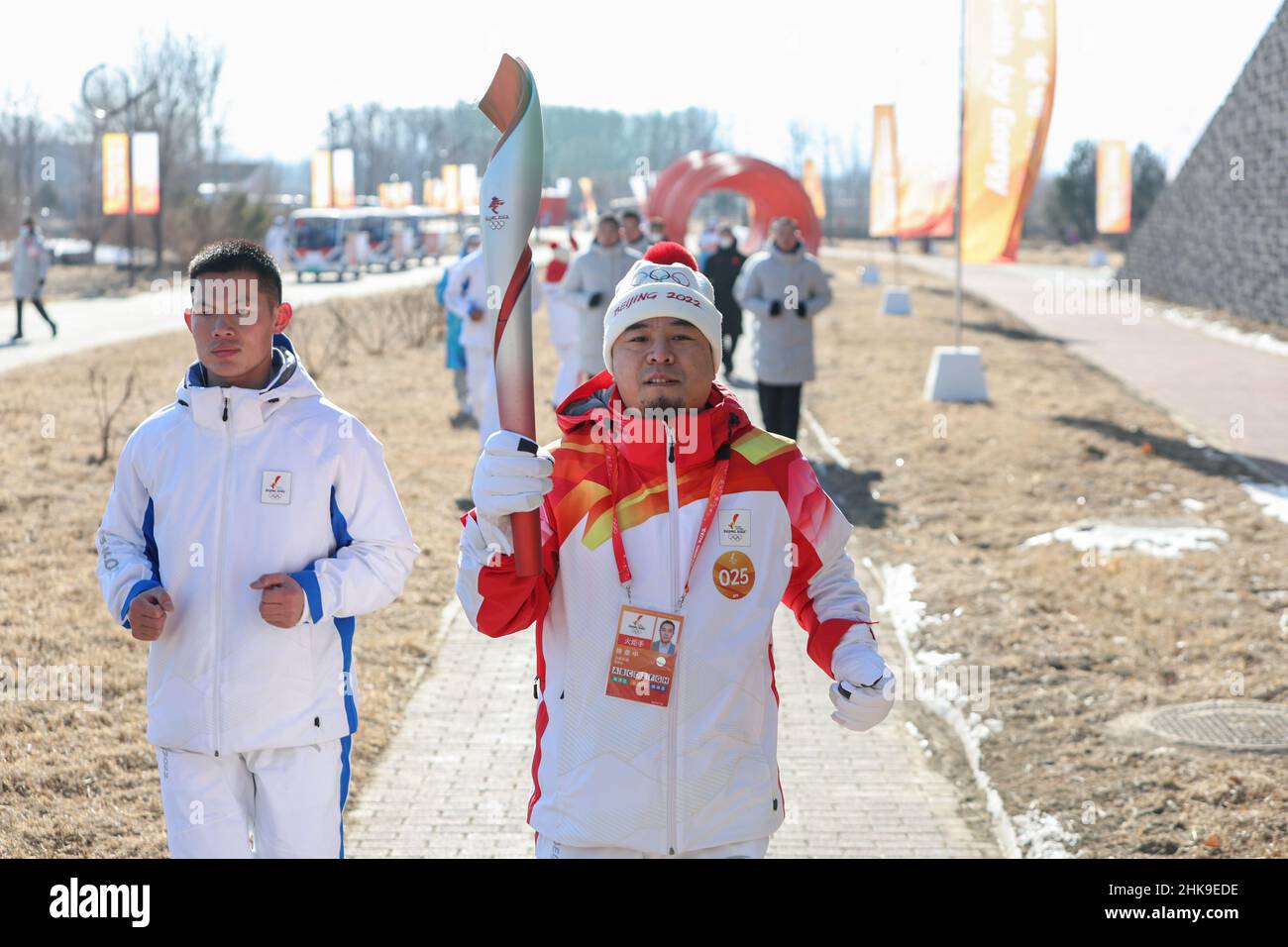 Beijing, China. 3rd Feb, 2022. Torch bearer Yao Yanzhong runs with the torch during the Beijing ...