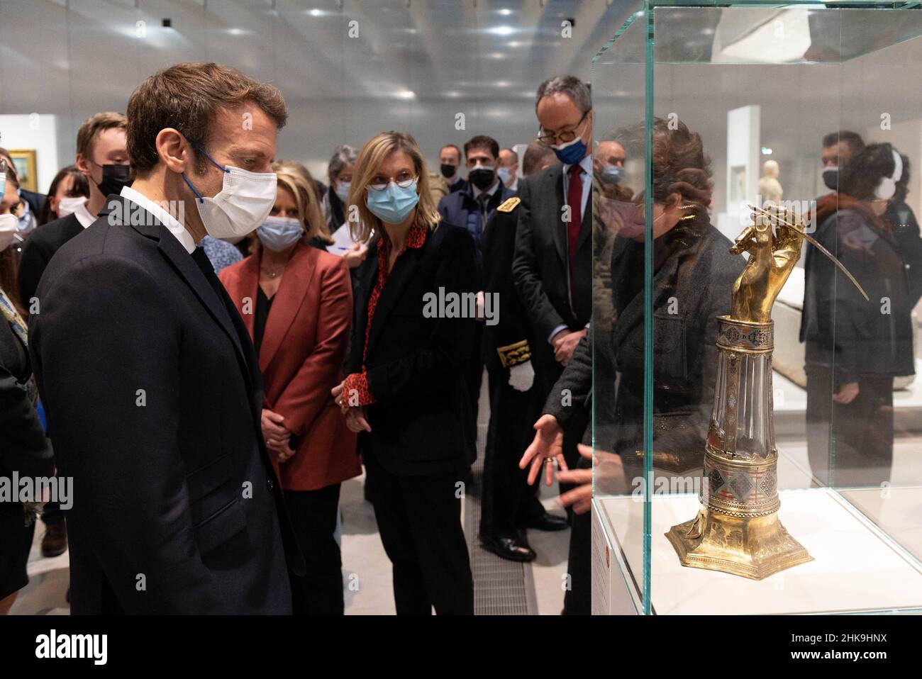President Emmanuel Macron looks at items from ancient Egypt installed ...