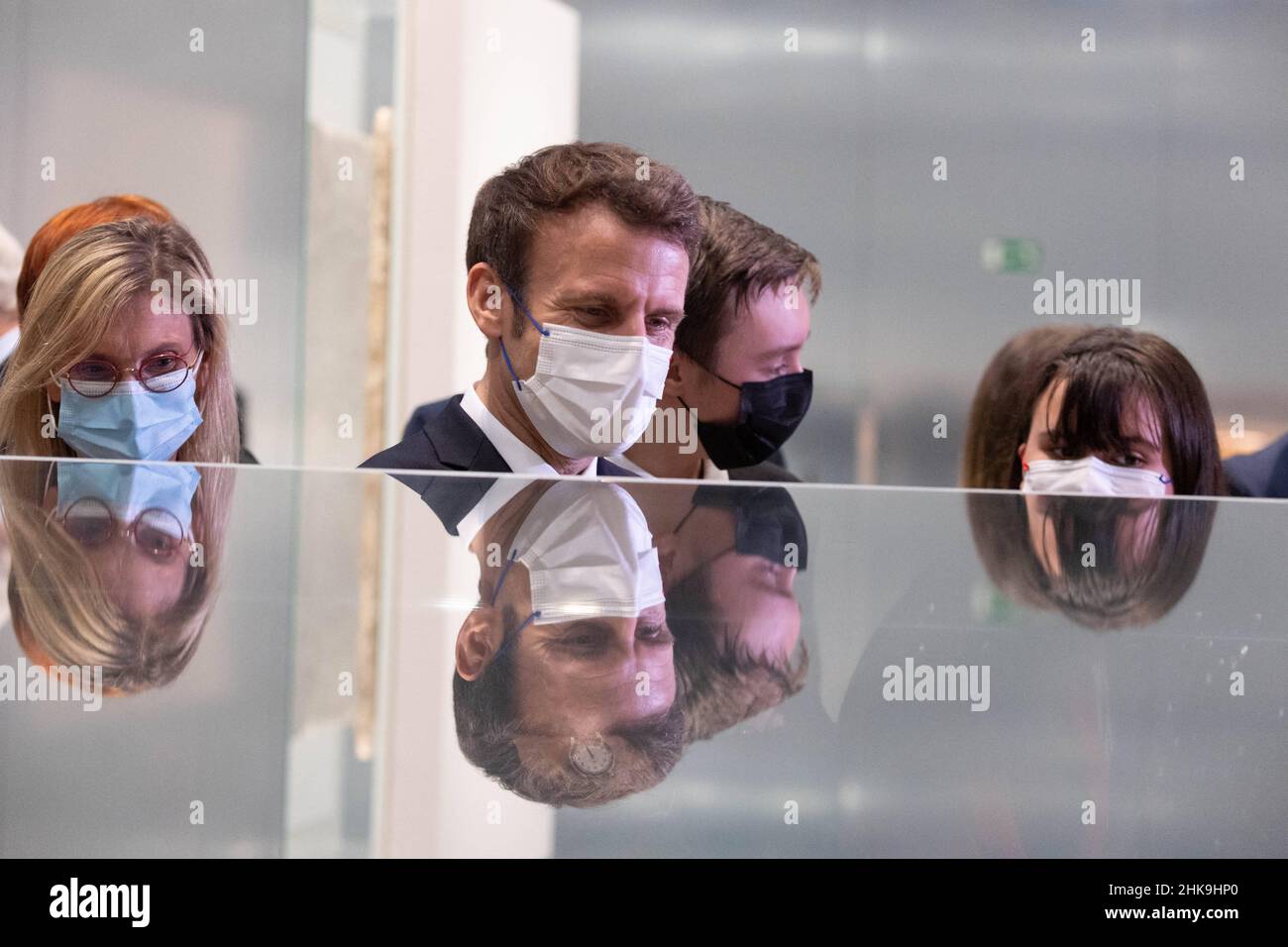 President Emmanuel Macron looks at items from ancient Egypt installed ...