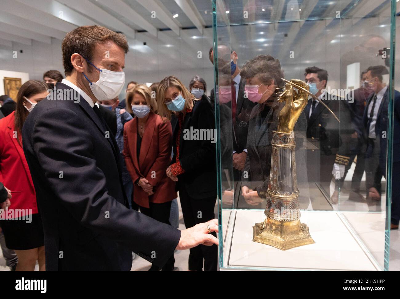 President Emmanuel Macron looks at items from ancient Egypt installed ...