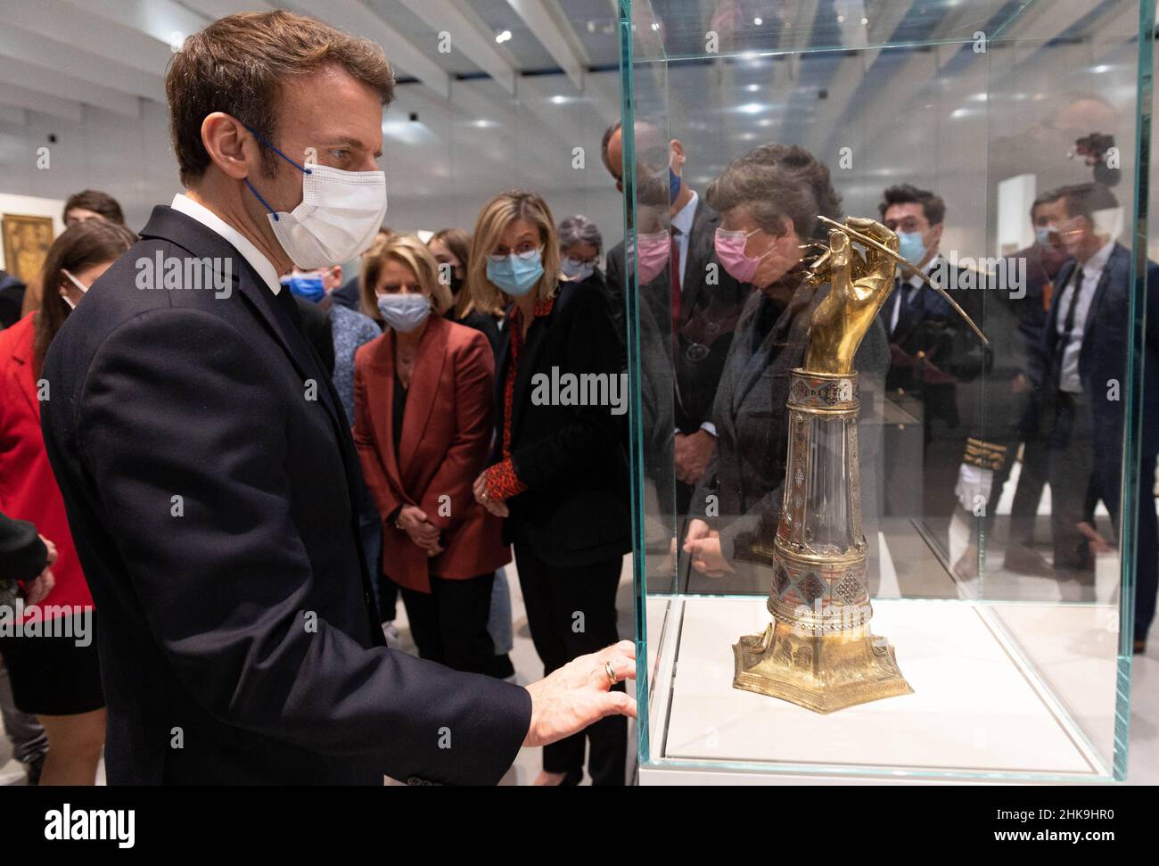 President Emmanuel Macron looks at items from ancient Egypt installed ...