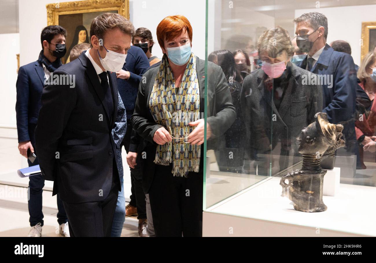 President Emmanuel Macron looks at items from ancient Egypt installed ...