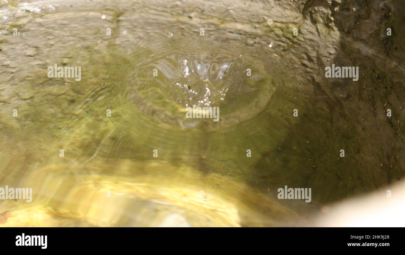 Circular dim water. Pure water vibration Stock Photo - Alamy