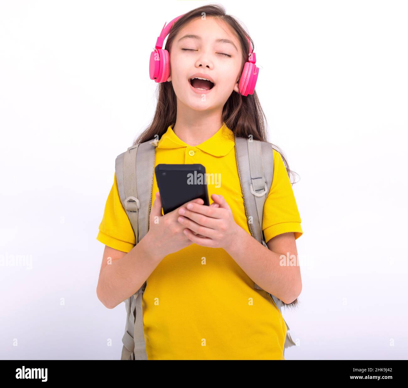 Happy student girl Listening music with headphones and sing song Stock ...