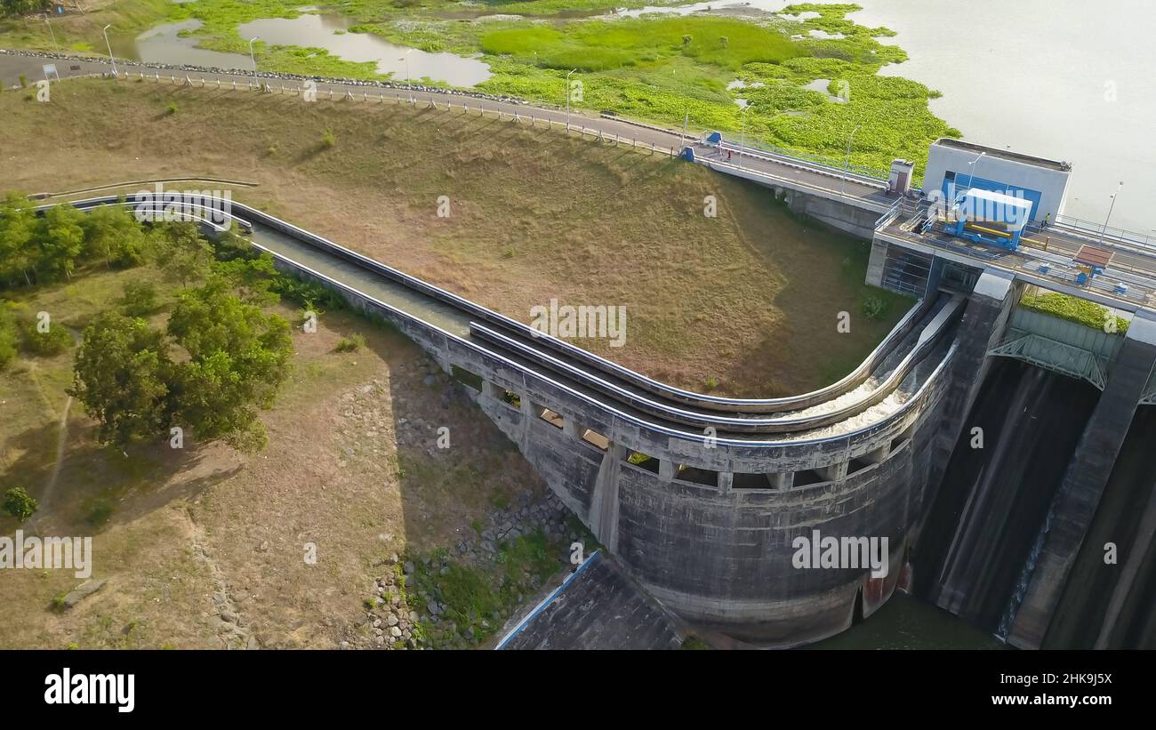 Water in dam concrete spillway infrastructure at reservoir. Waterfall ...