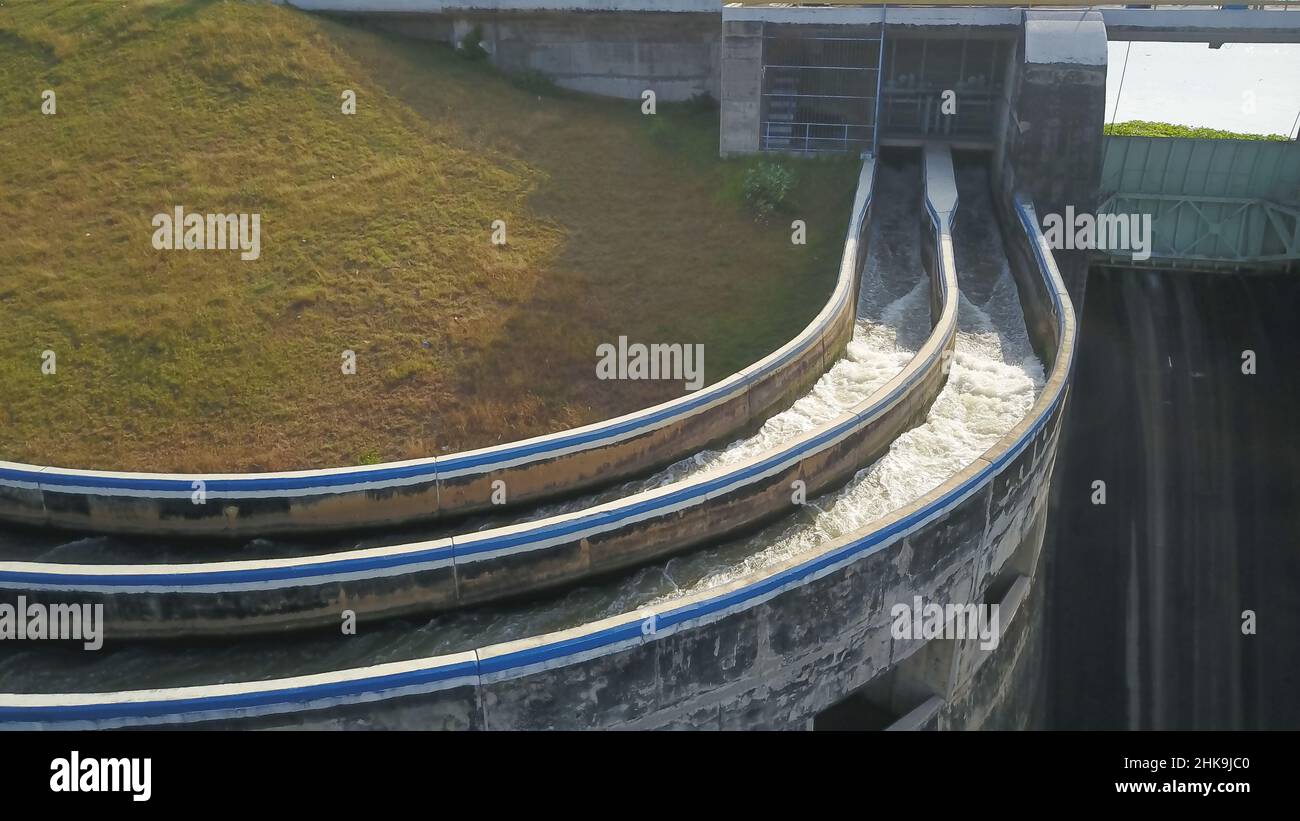 Aerial water in dam concrete spillway infrastructure at reservoir ...