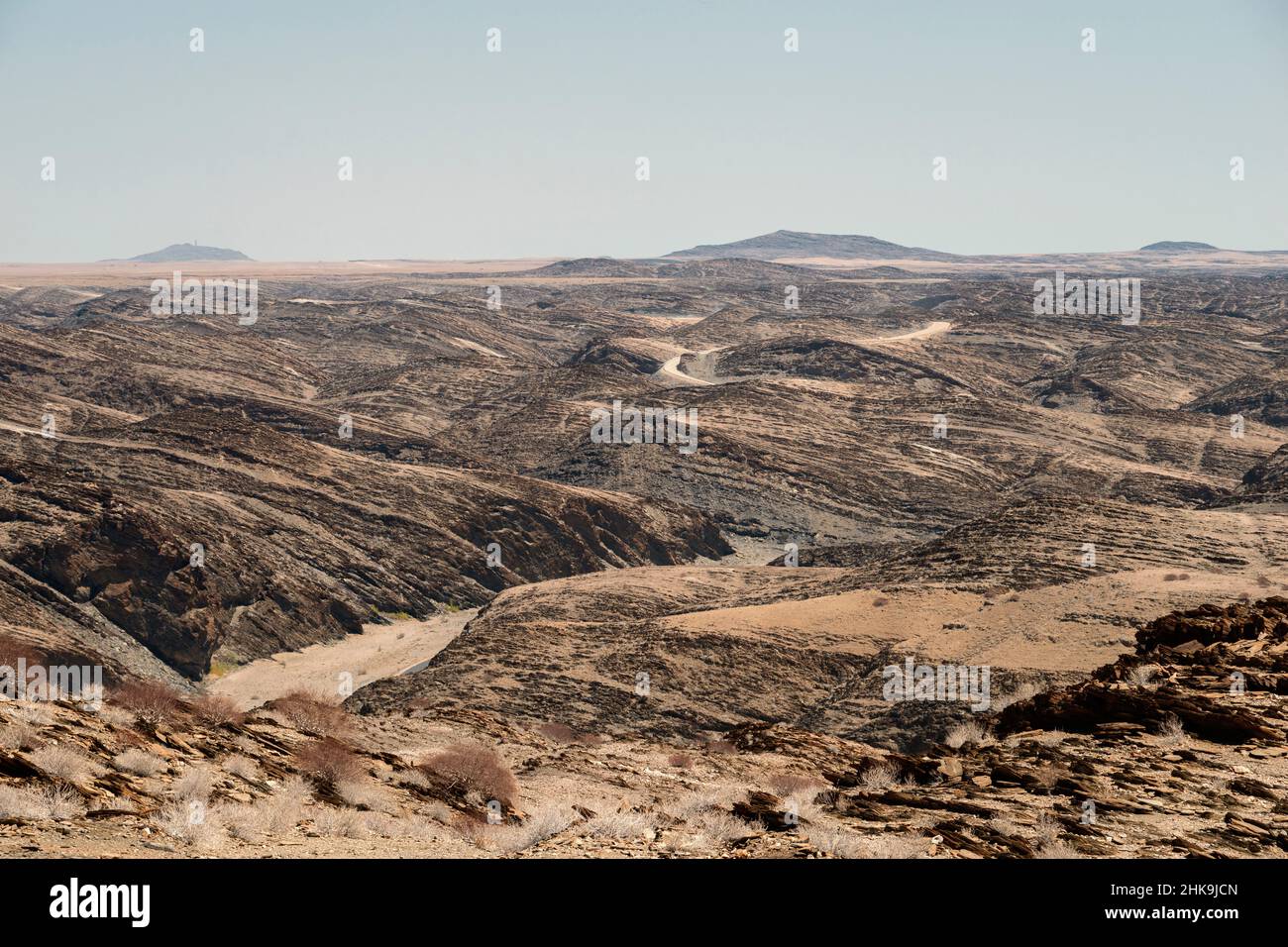rocky desert land with dry river canyon in Namibia Stock Photo - Alamy