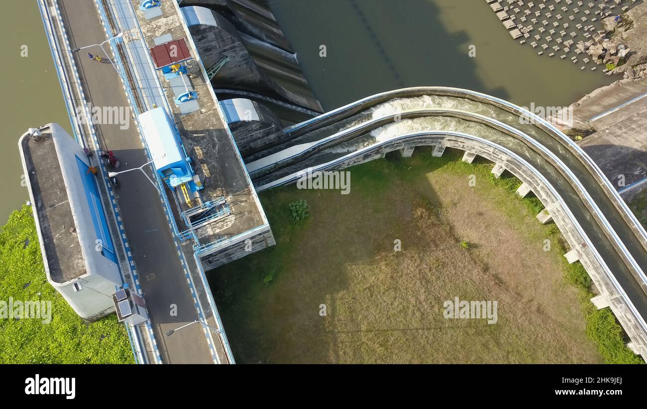 Water in dam concrete spillway infrastructure at reservoir. Waterfall ...