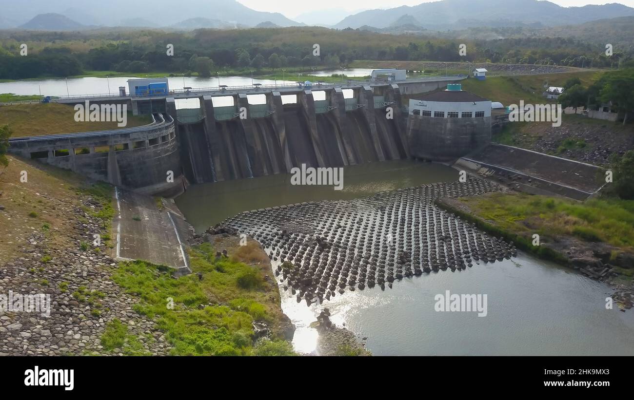 Hydroelectric dam with flowing water through gate, aerial view from ...