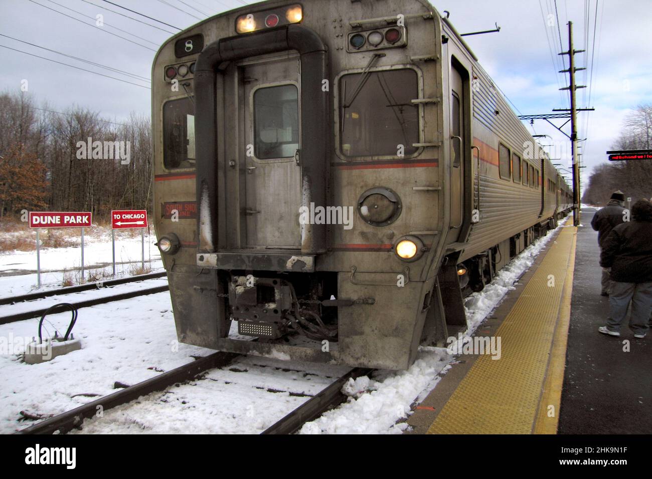 A commuter train pulls into a snowy stop in Indiana Stock Photo - Alamy
