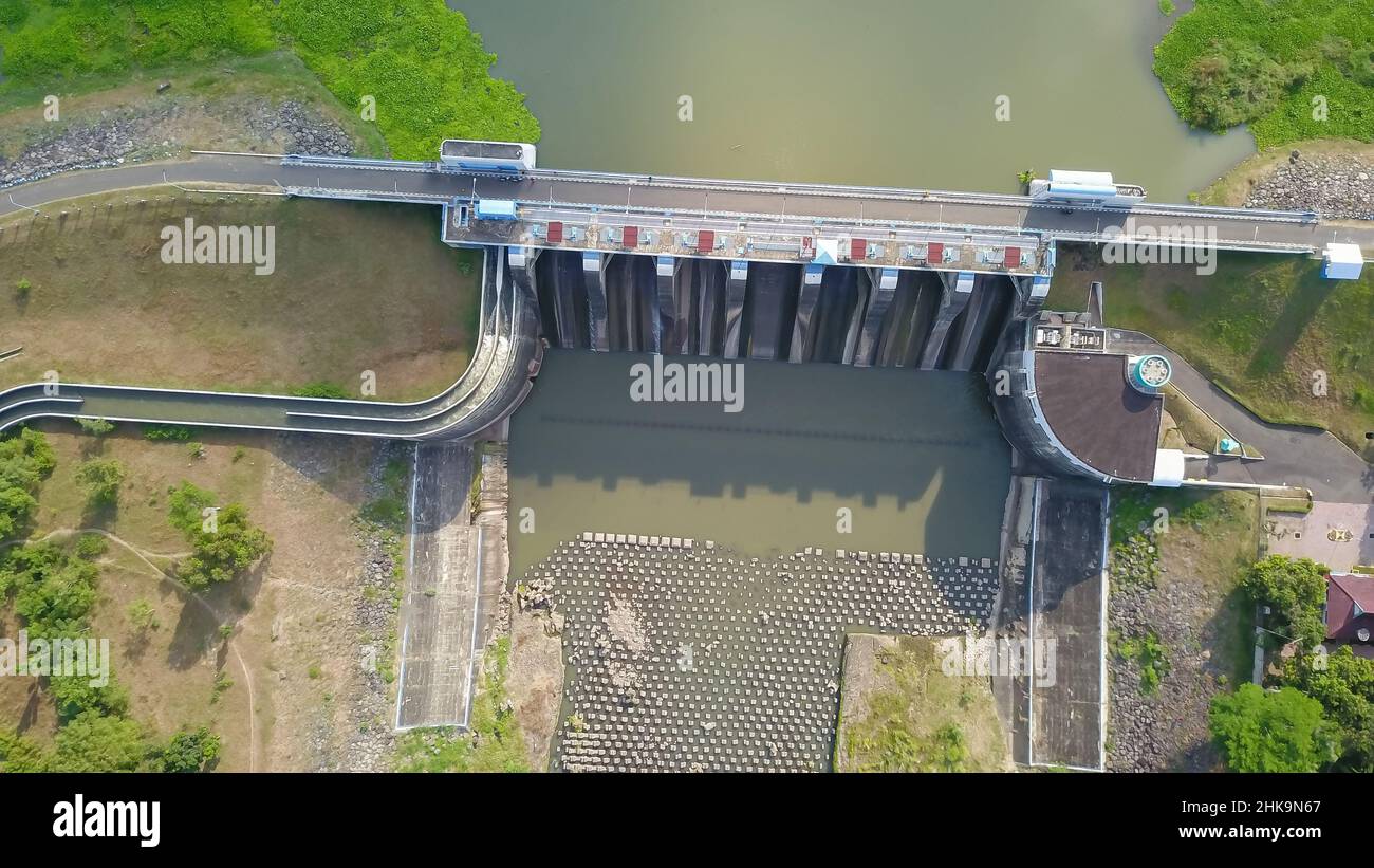 Water in dam concrete spillway infrastructure at reservoir. Waterfall ...