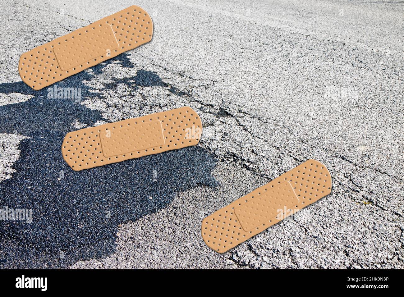 Old dangerous damaged cracked asphalt road surface with patch - concept ...