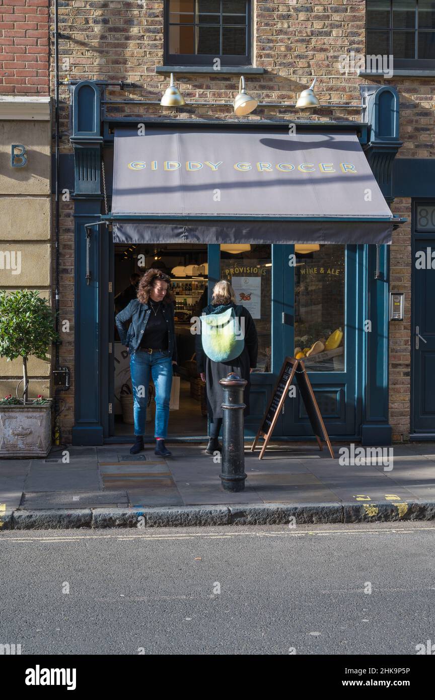 Customers shopping at the Giddy Grocer, a gourmet grocery store ...