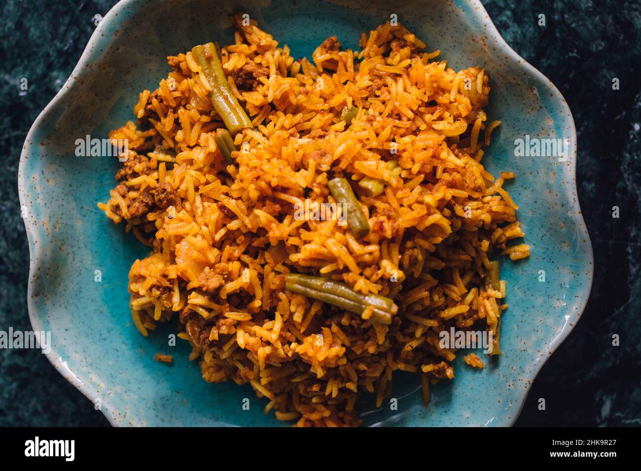 Lubia polo Persian rice dish with ground beef, green beans, turmeric ...