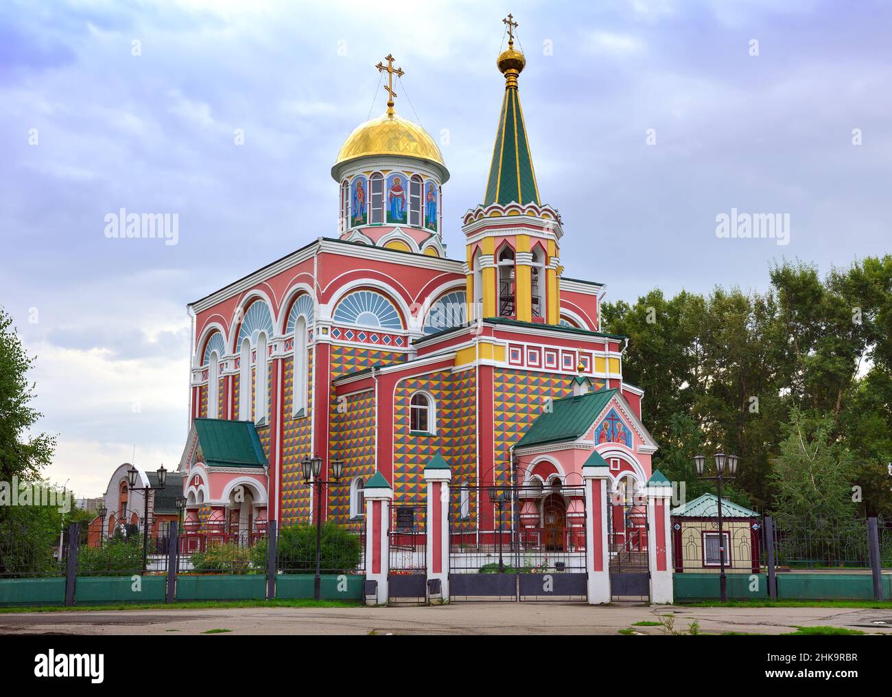 Colorful Orthodox church under a blue cloudy sky. Abakan, Khakassia ...